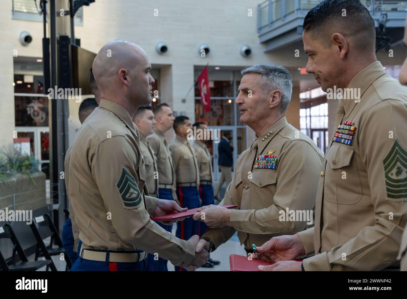 U.S. Marine Corps Gunnery Sgt. Russell B. Cowan, left, a recruiter with ...