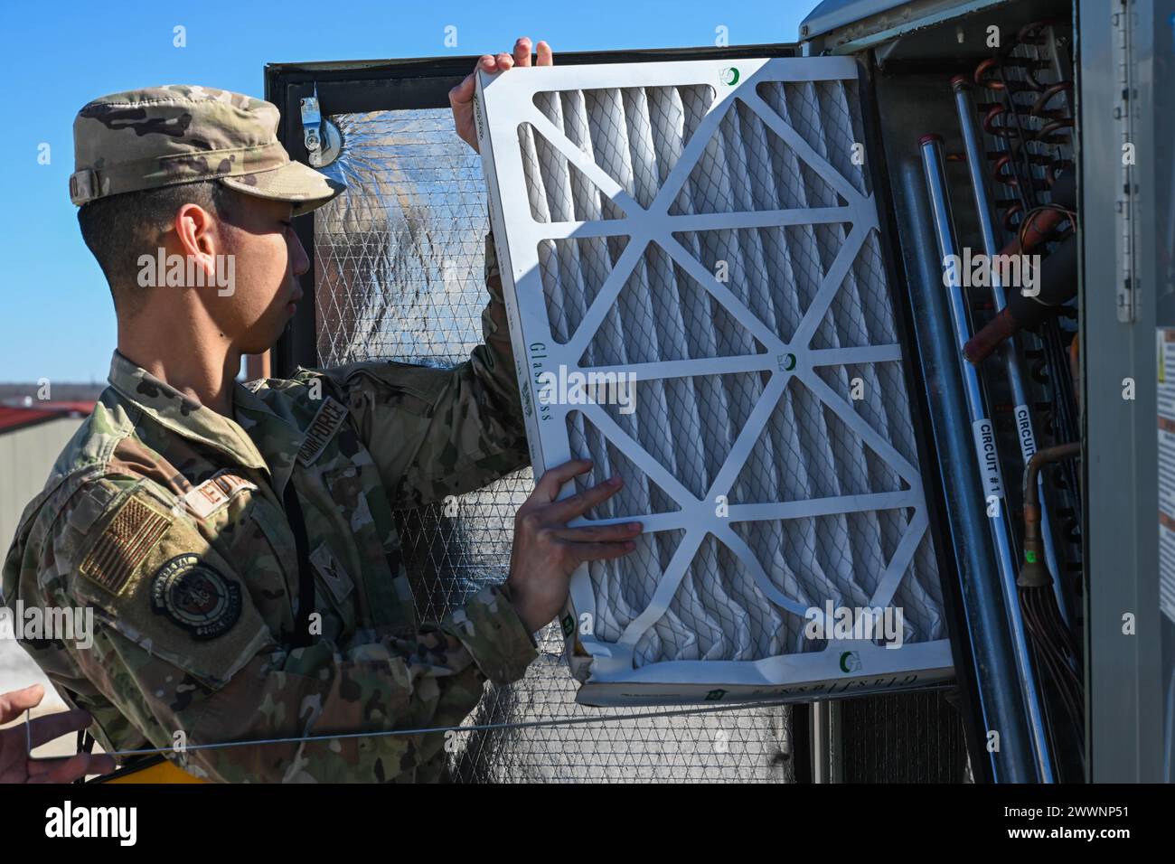 Senior Airman Jan Detoyato, 2nd Civil Engineer Squadron heating ...