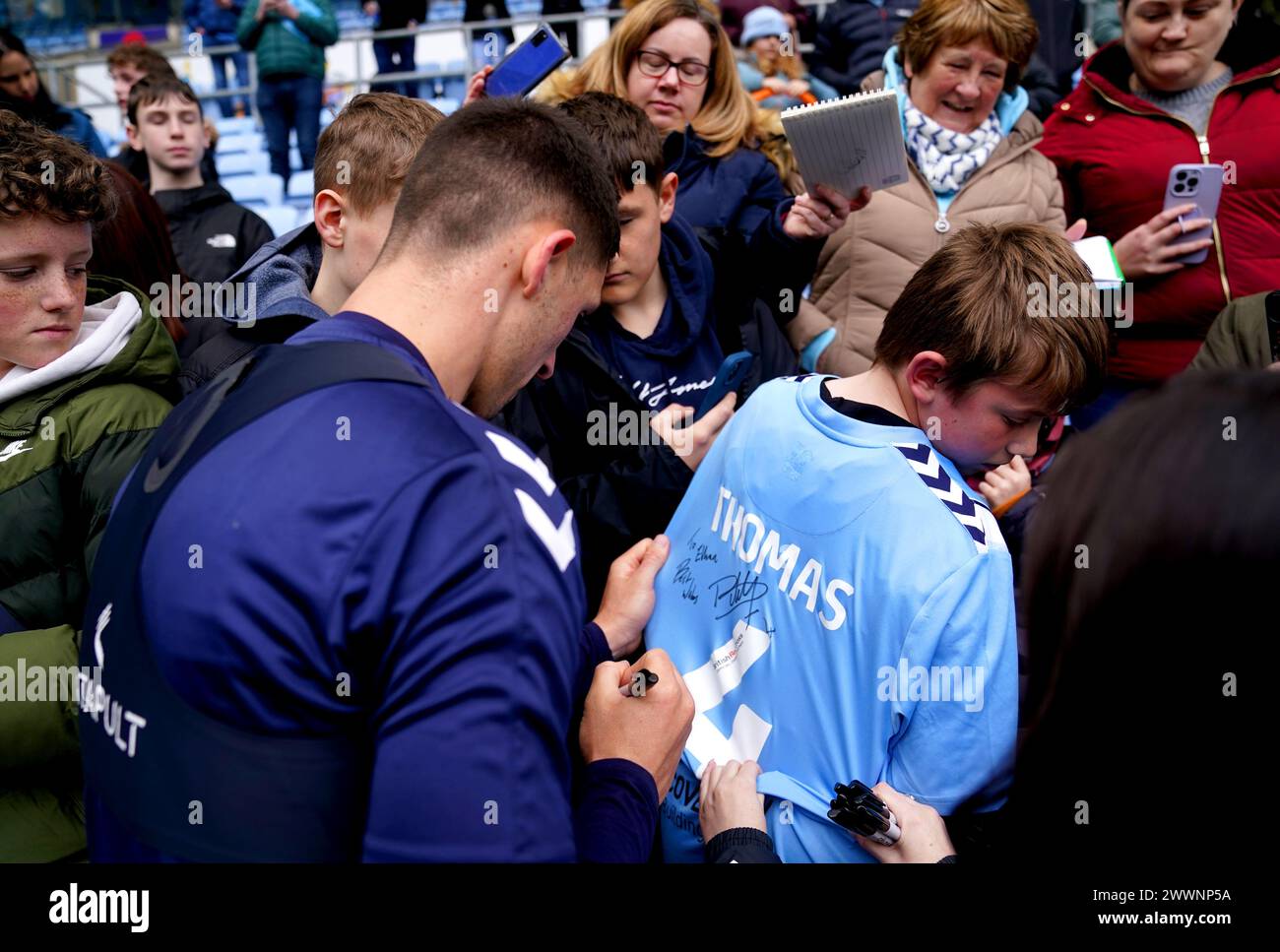Coventry City's Bobby Thomas signs a shirt for a fan after a training session at the Coventry ...