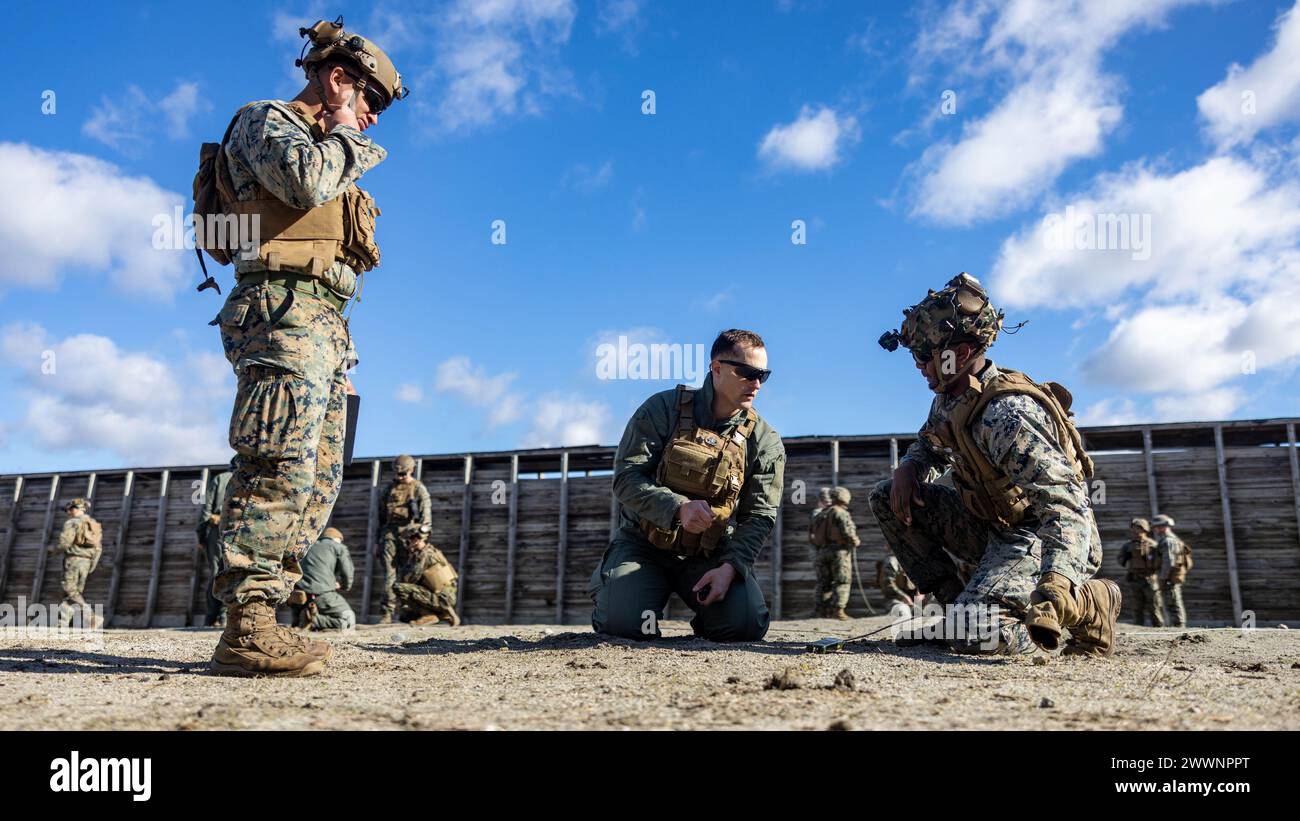 U.S. Marine Corps Sgt. Mitchel Swafford, center, an explosive ordnance ...