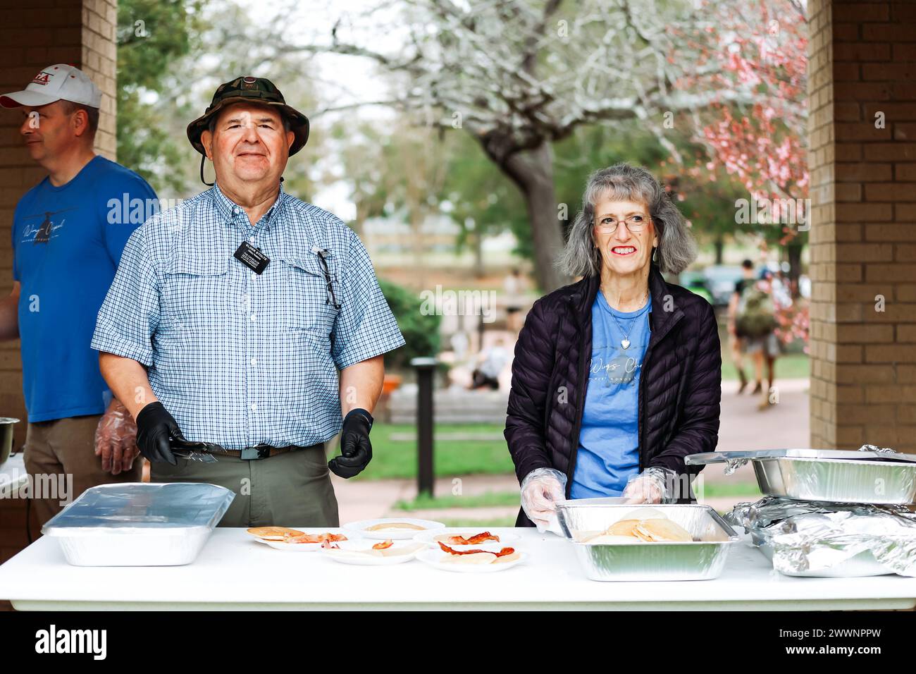 John and Martha Stoltz, Wings Chapel volunteers, serve pancakes to ...