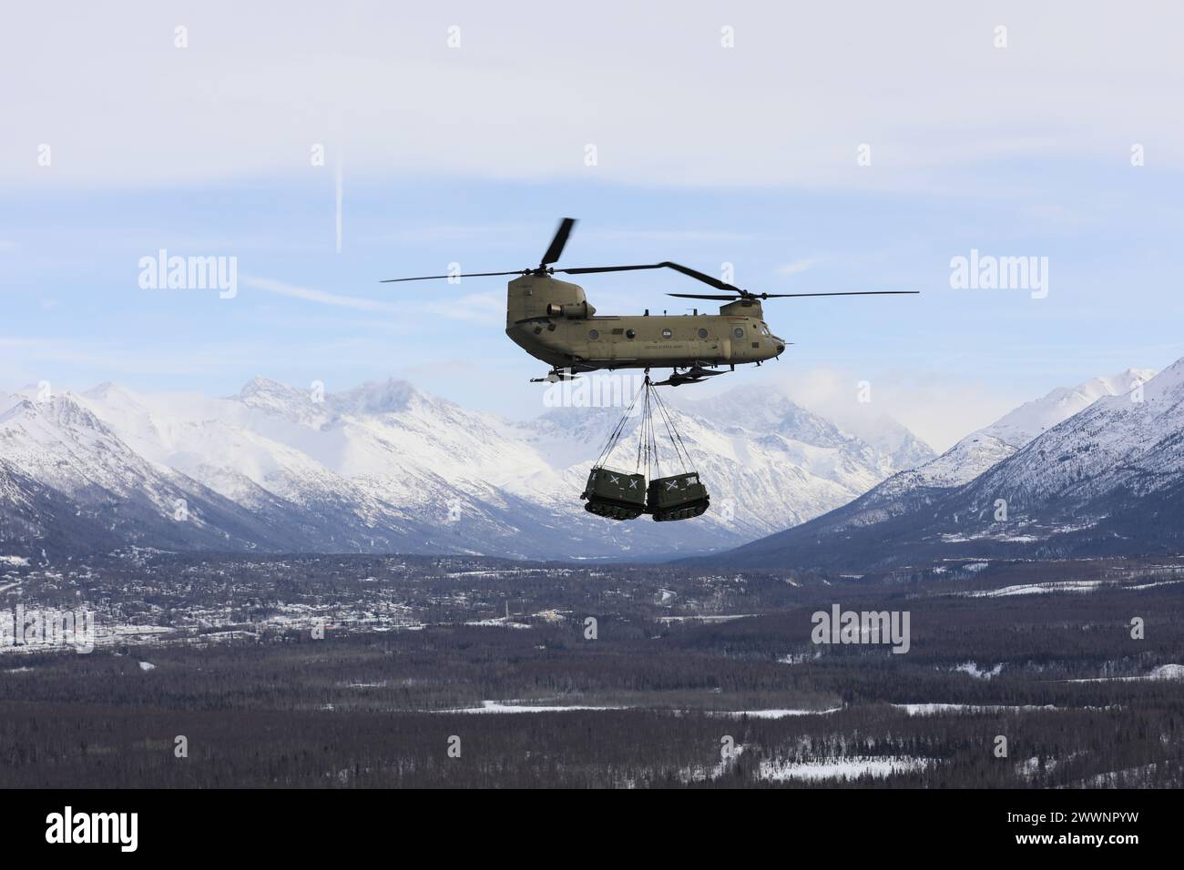 With the Chugach Mountains in the background, an Alaska Army National ...