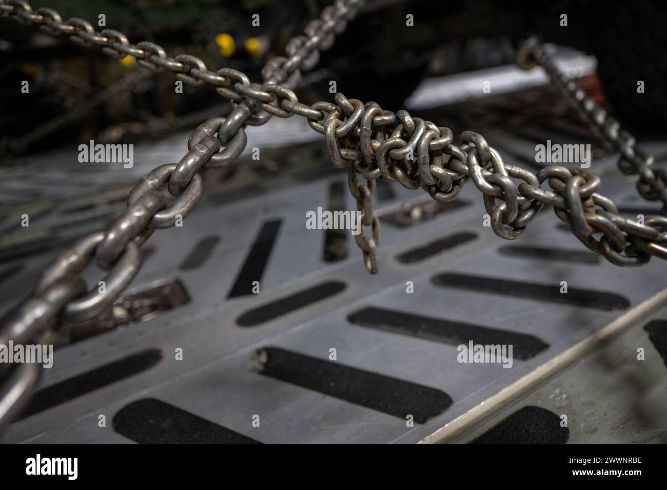 A chain is used to secure a High Mobility Multipurpose Wheeled Vehicle ...
