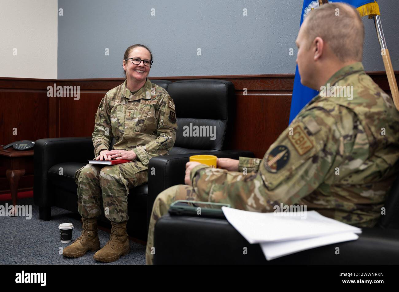 Maj. Gen. Stacy J. Huser, 20th Air Force commander, speaks with Col ...
