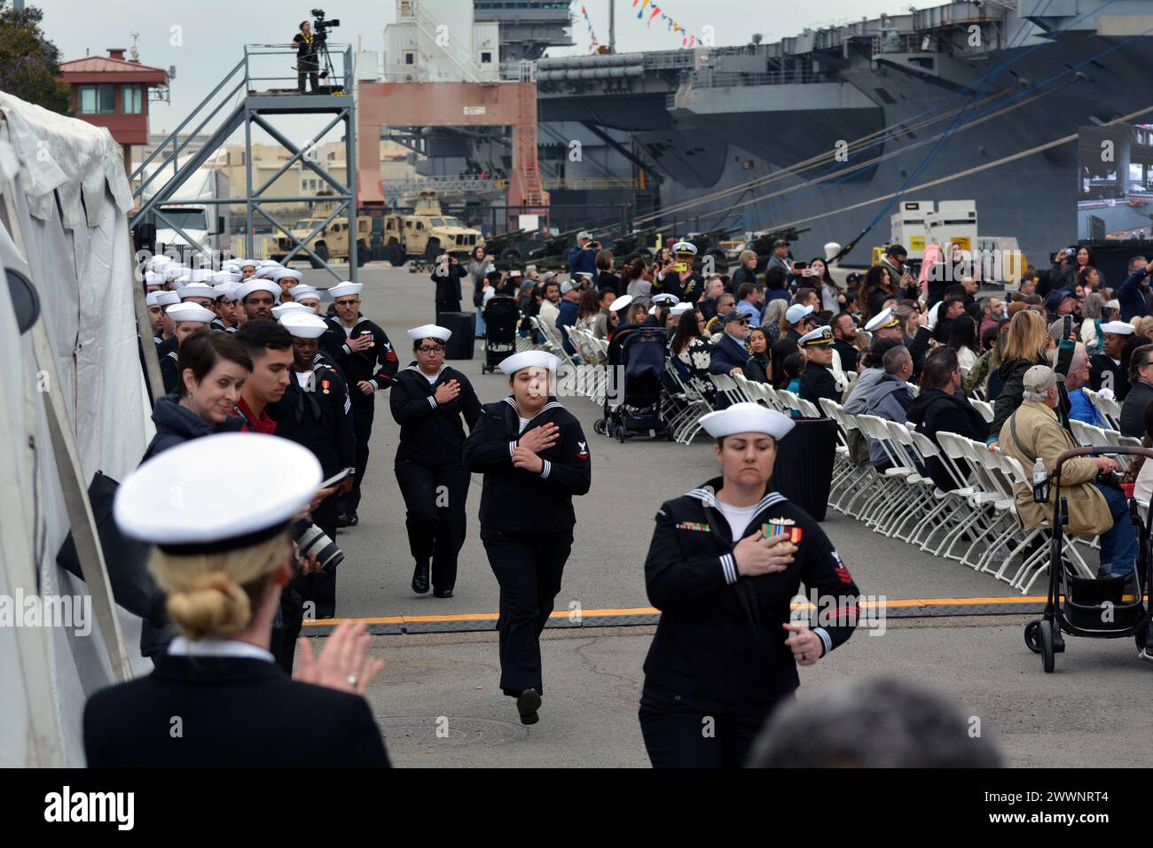 Ship's crew members of USS John L. Canley (ESB 6) man the ship during ...