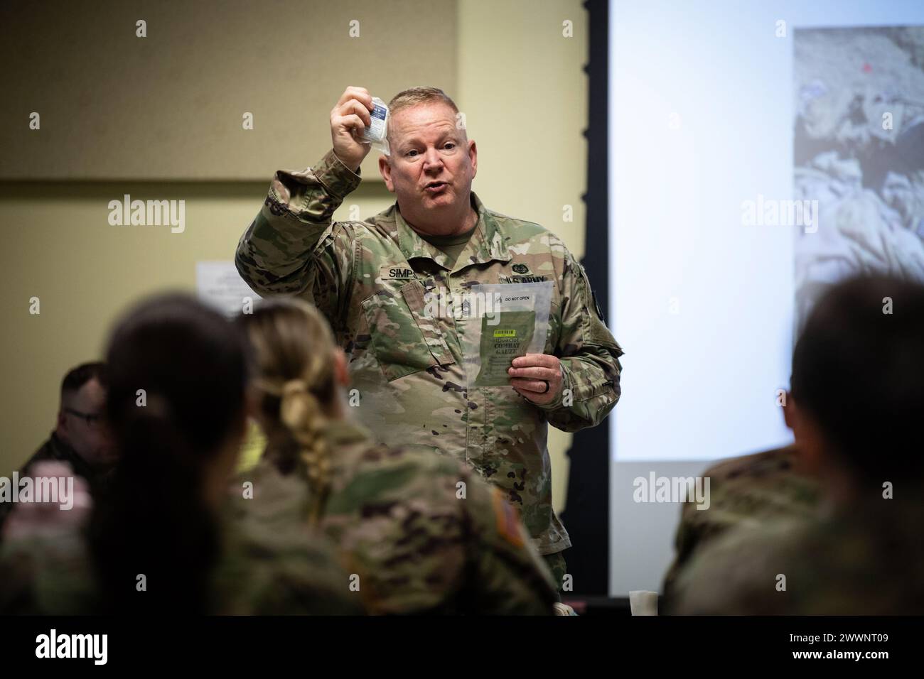 U.S. Army Master Sgt. Aaron Simpson, a medic assigned to Alpha Company ...