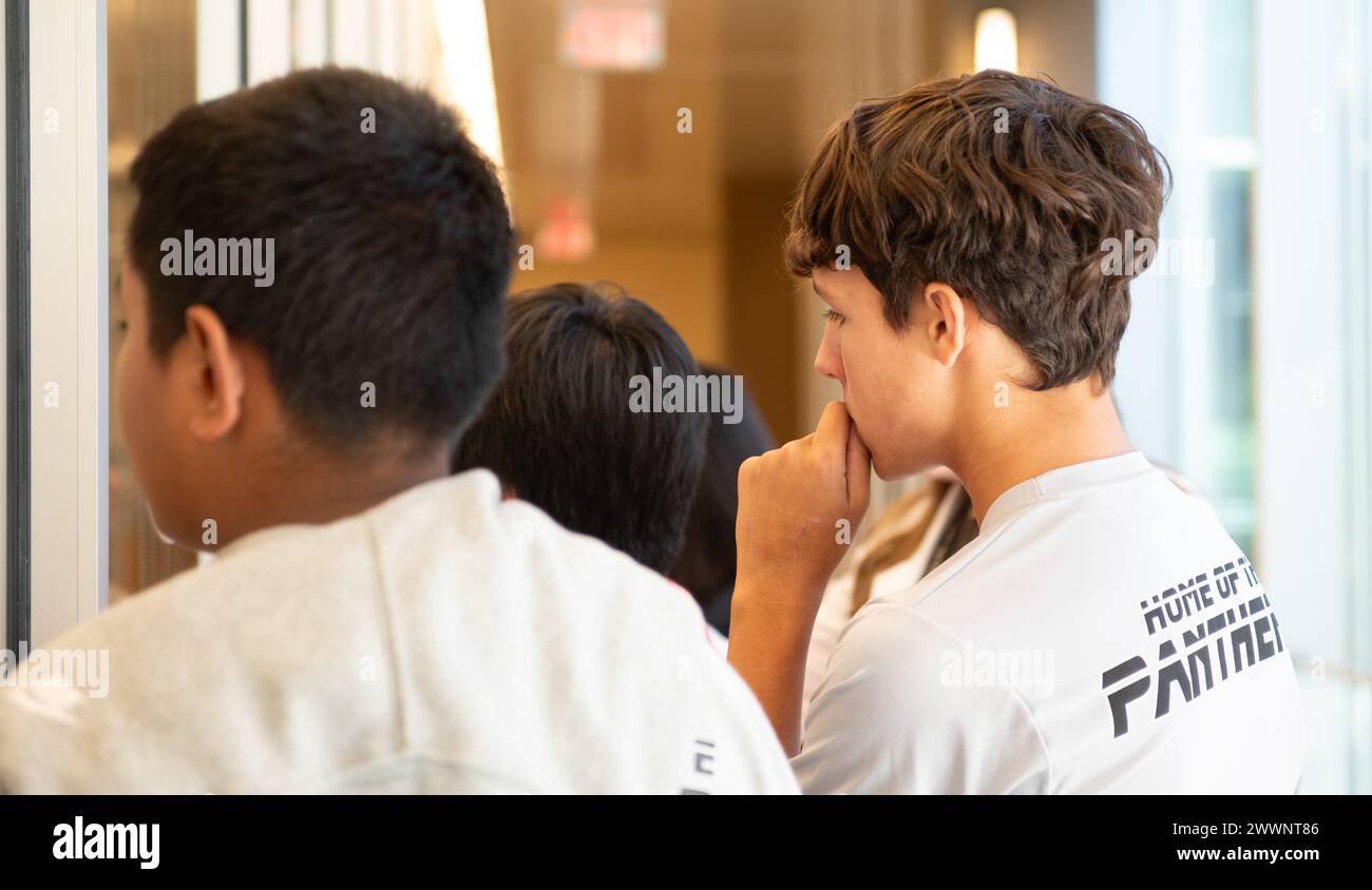 Students from the Aliamanu Middle School are briefed about different past conflict projects ...