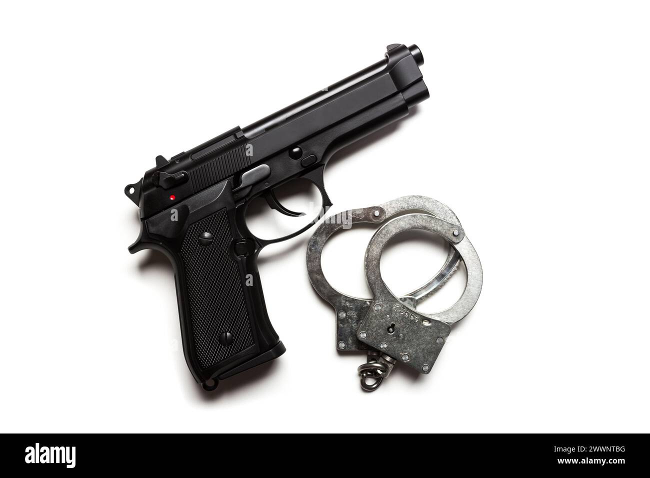 gun and handcuffs on white background Stock Photo - Alamy