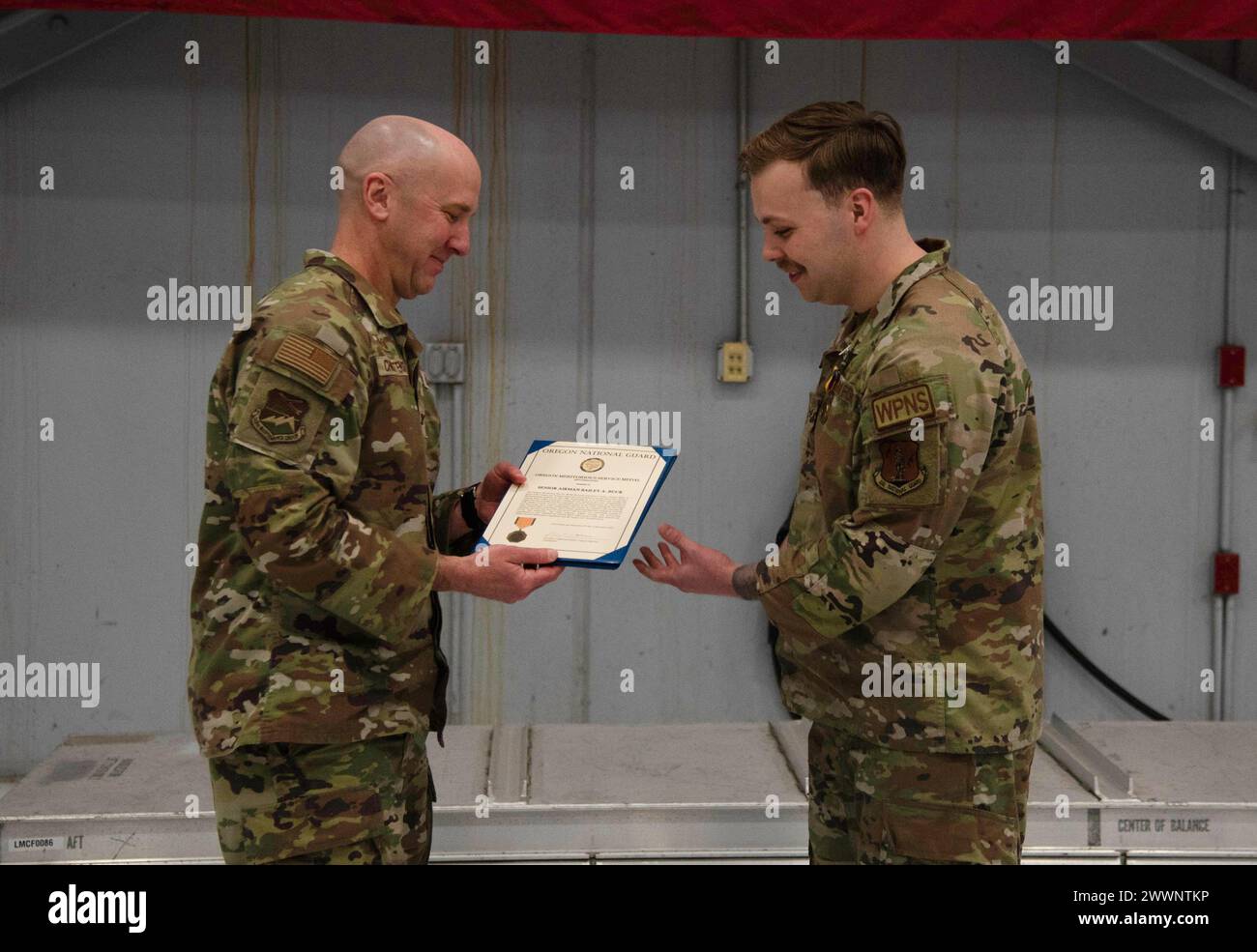 142nd Maintenance Group Commander, Col. David Christensen, presents ...