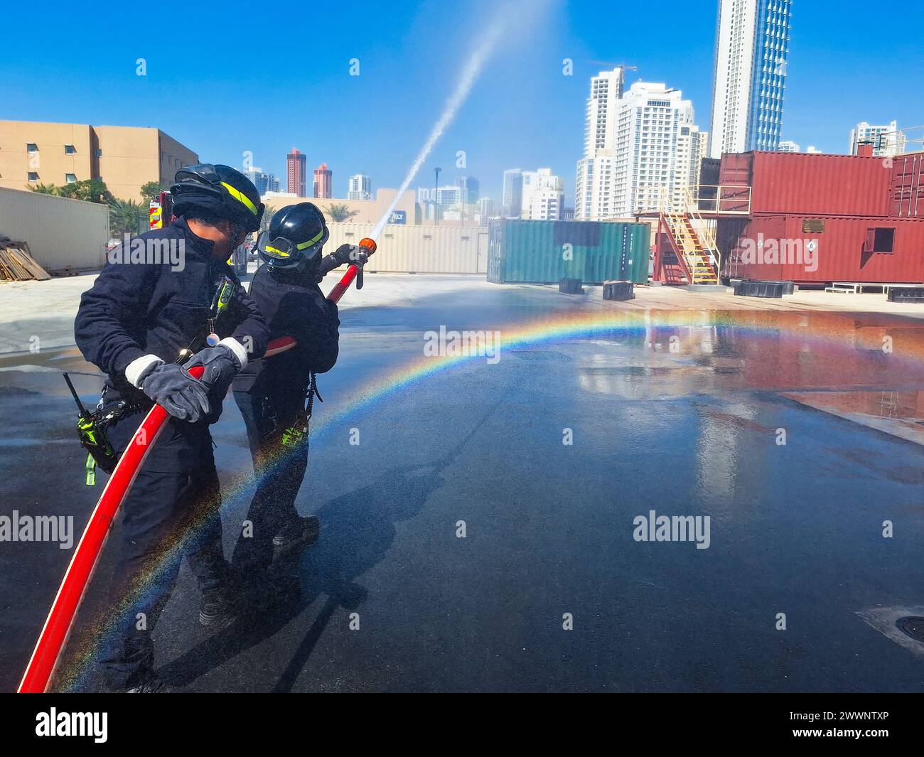 240204-N-AC117-1003 Firefighters Abdulqaher Saleh, from Bahrain, right ...