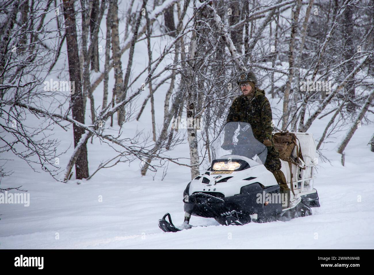 A U.S. Marine with II Marine Expeditionary Force navigates snowy ...