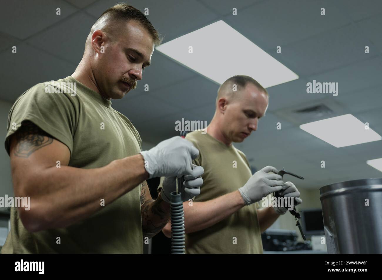 U.S. Air Force Airman 1st Class Marcus Kelley (left) and Staff Sgt ...