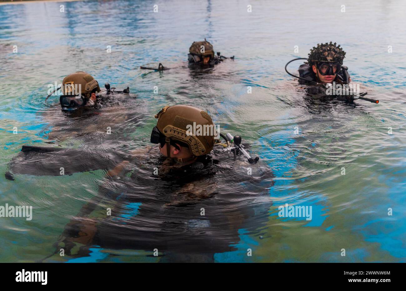 U.S. Marines surface the water during a dive sustainment training on ...