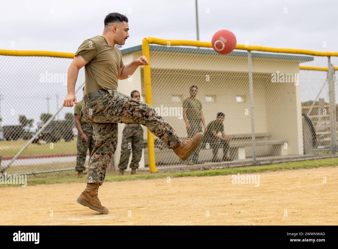 A U.S. Marine with Marine Air Control Group (MACG) 18, plays kickball ...