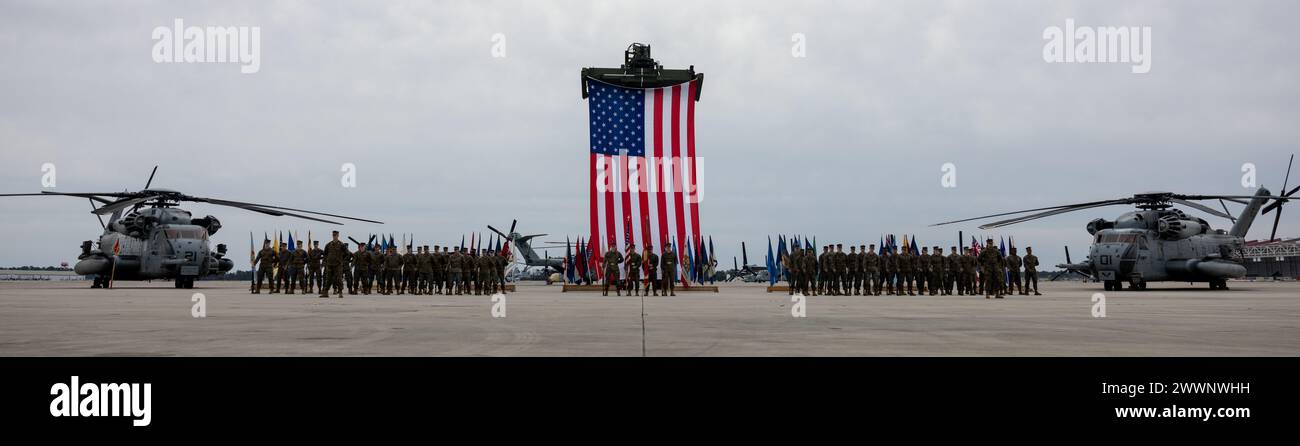 U.S. Marines with Marine Heavy Helicopter Squadron (HMH) 464 stand in ...
