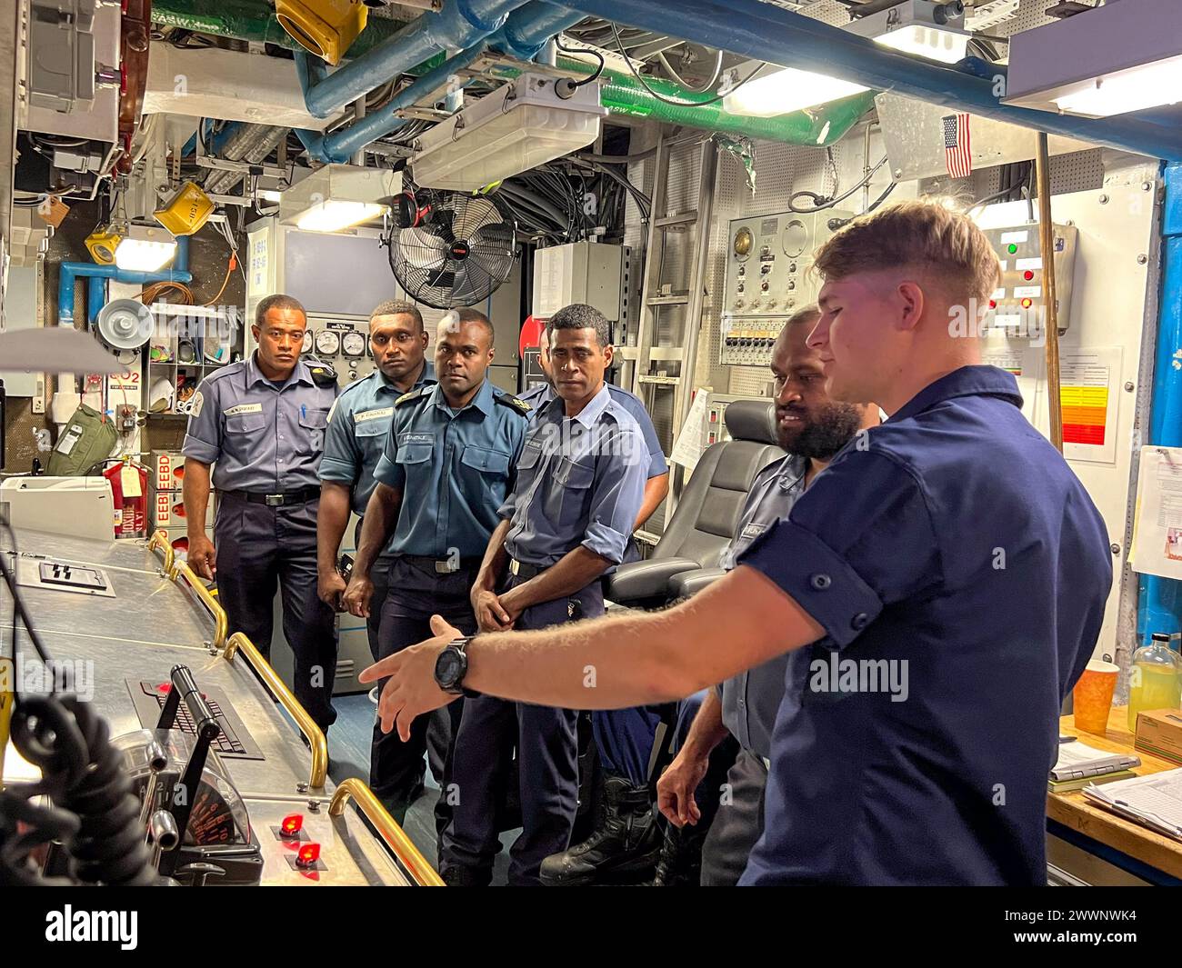 U.S. Coast Guard Ensign Aaron Motis, an in-port officer of the day ...