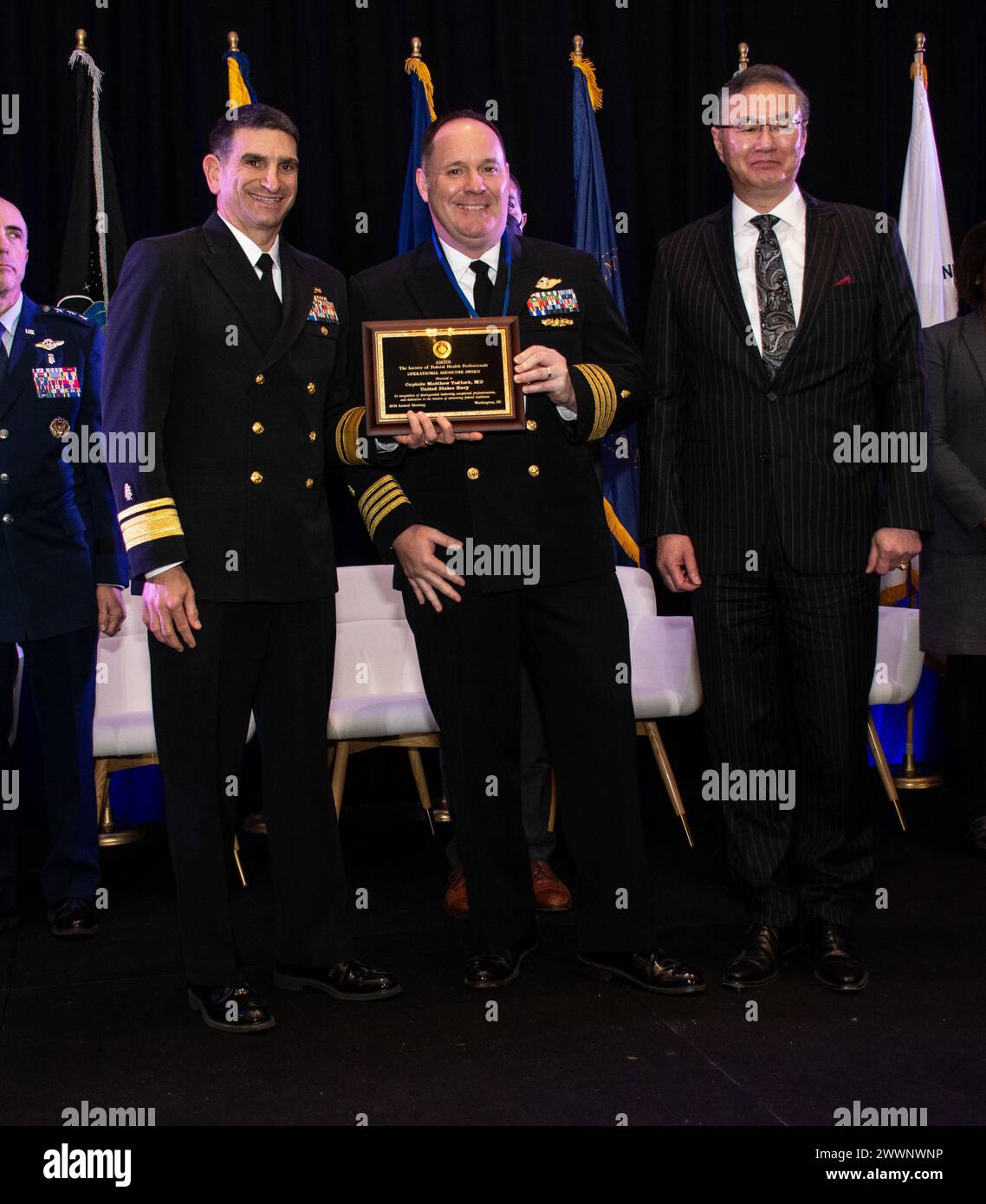 U.S. Navy Capt. Matthew Tadlock was presented with the Operational ...