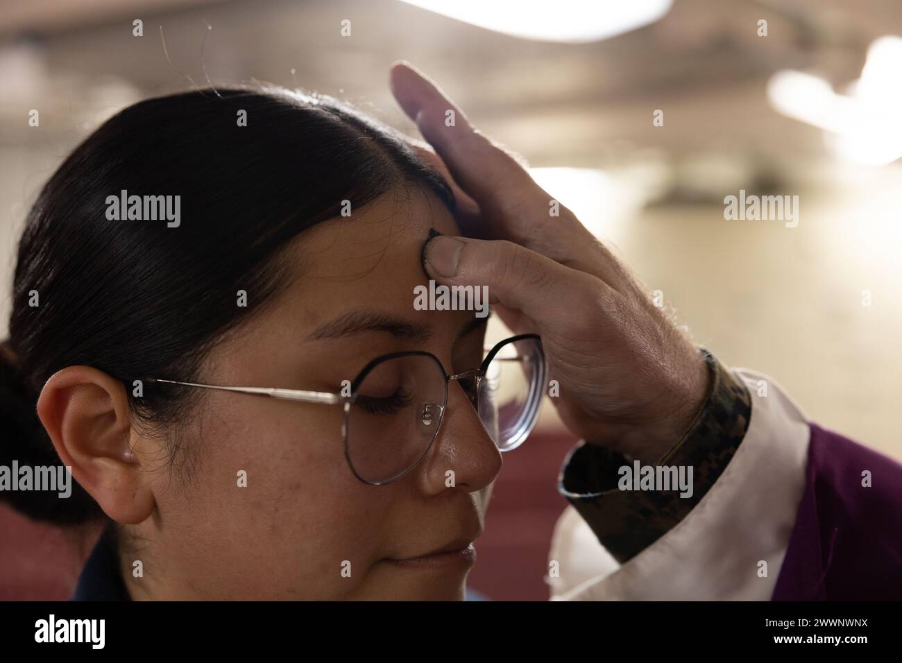 U.S. Navy Cmdr. Daniel Fullerton, right, the chaplain of the amphibious ...