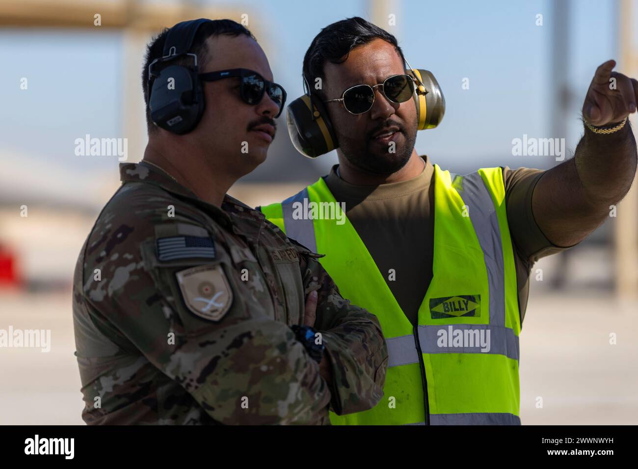 A Royal Air Force ground crew member and a U.S. Air Force crew chief ...