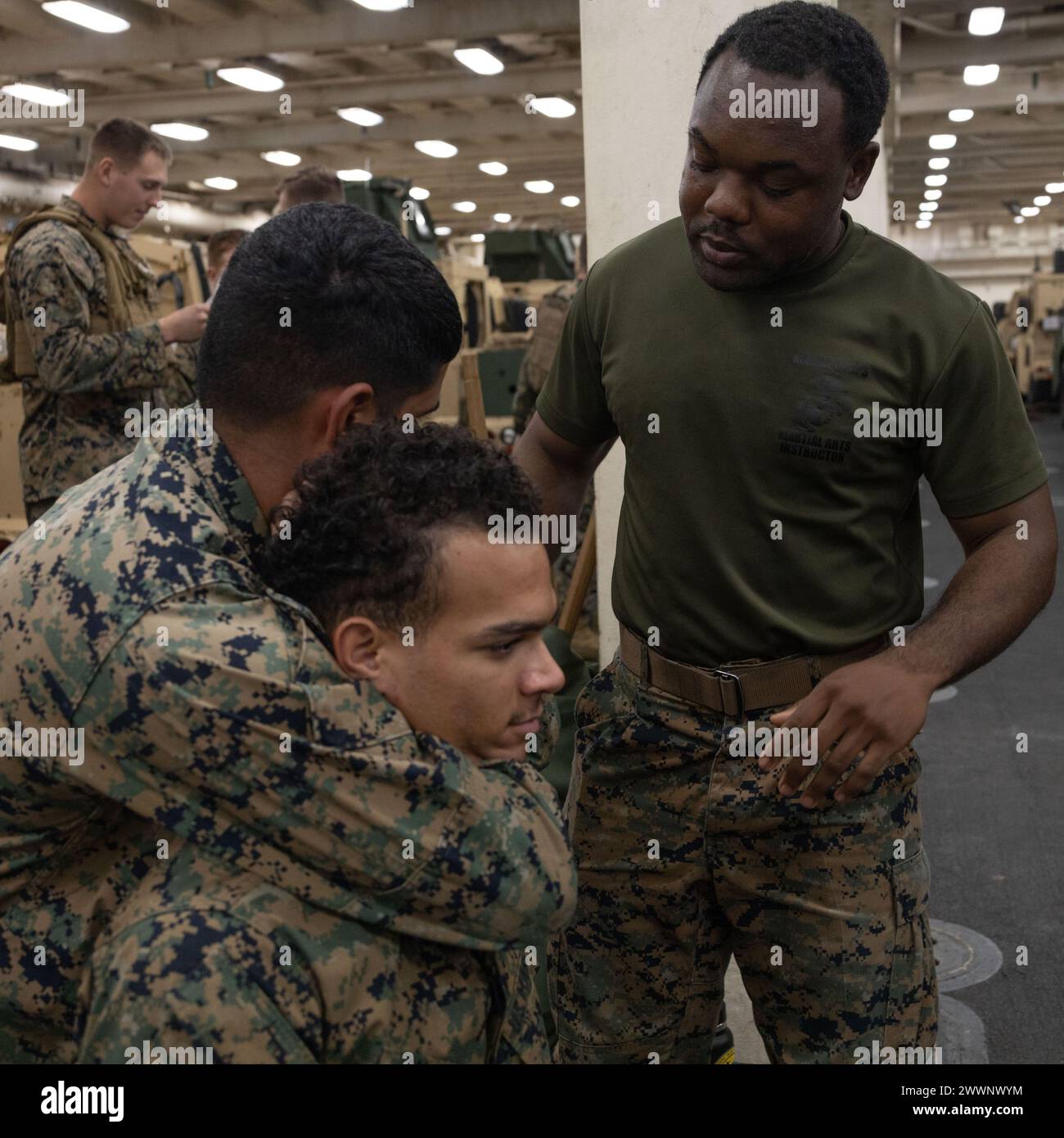 U.S. Marine Corps Cpl. Devanta Miller, right, a Marine Corps martial ...
