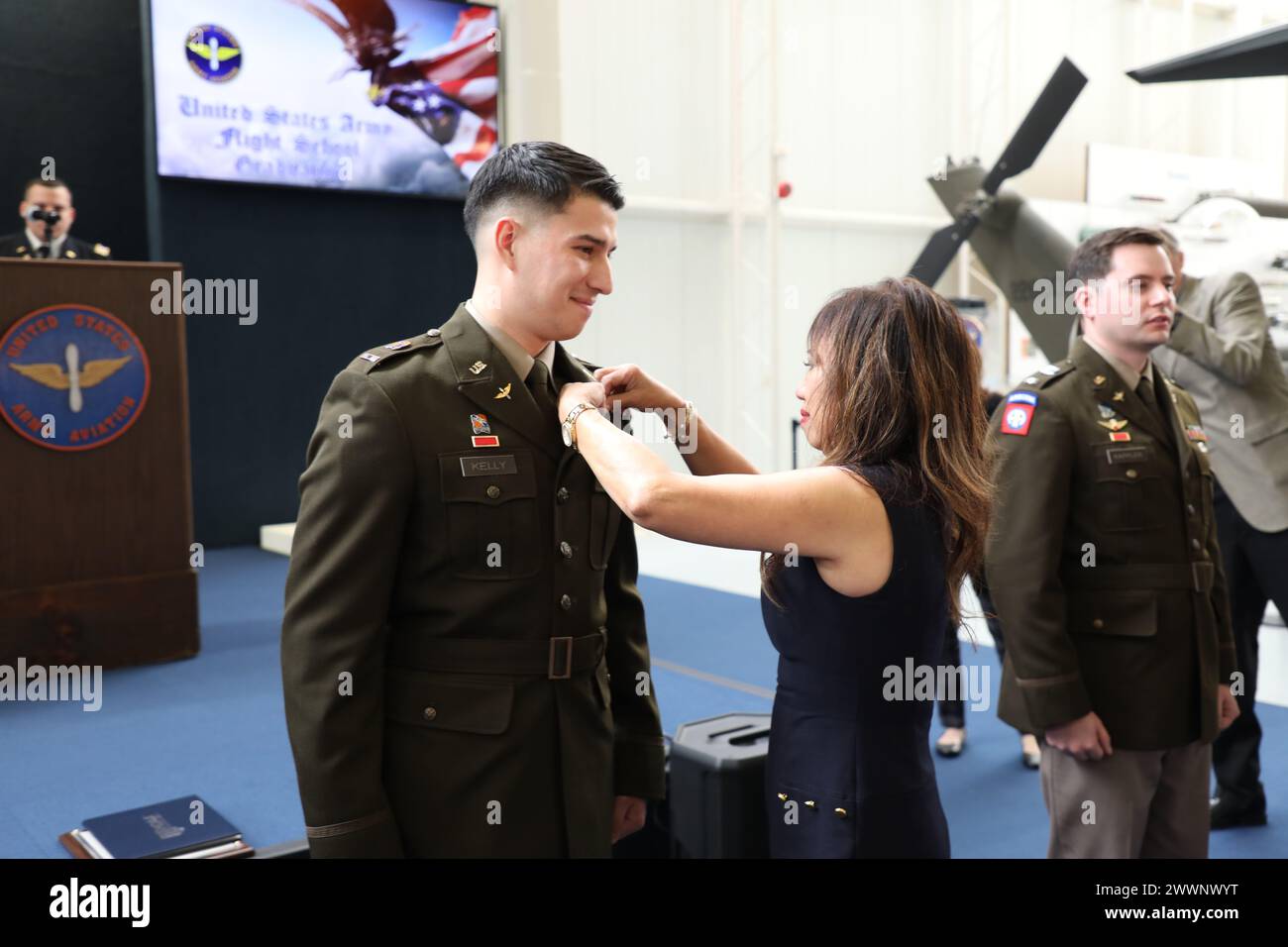 Warrant Officer Paul D. Kelly's mother Maria pins his silver wings on ...