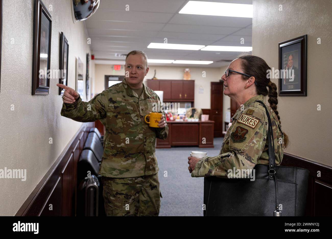 Maj. Gen. Stacy J. Huser, 20th Air Force commander, speaks with Col ...