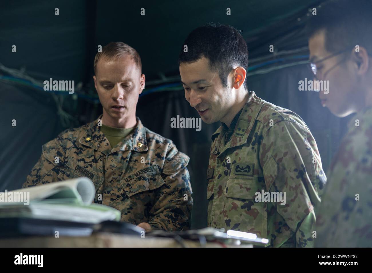 U.S. Marine Corps Maj. Joseph Grimison, left, operations officer with ...