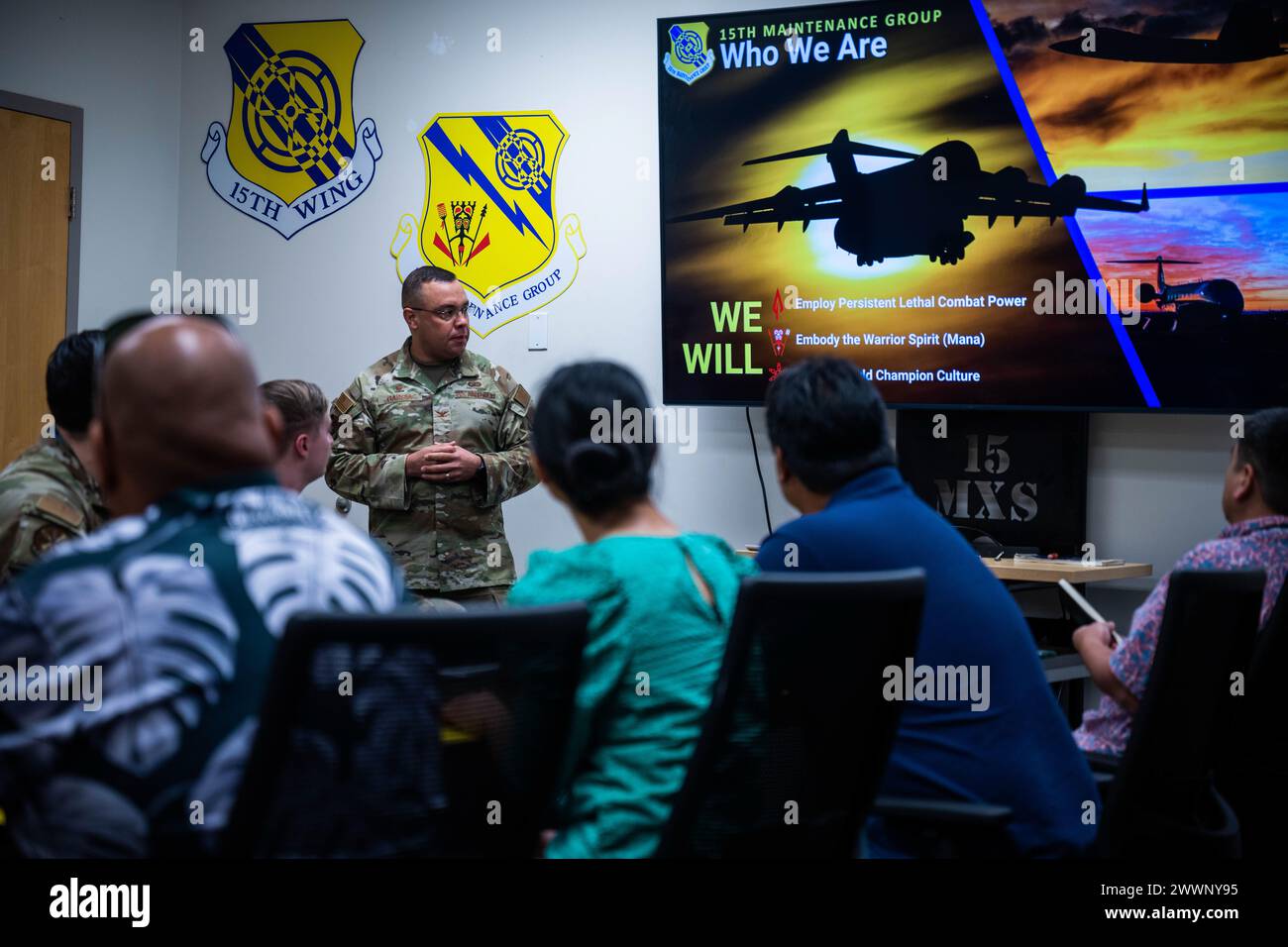 Col. Andrew Garcia, 15th Maintenance Group Commander, briefs members ...