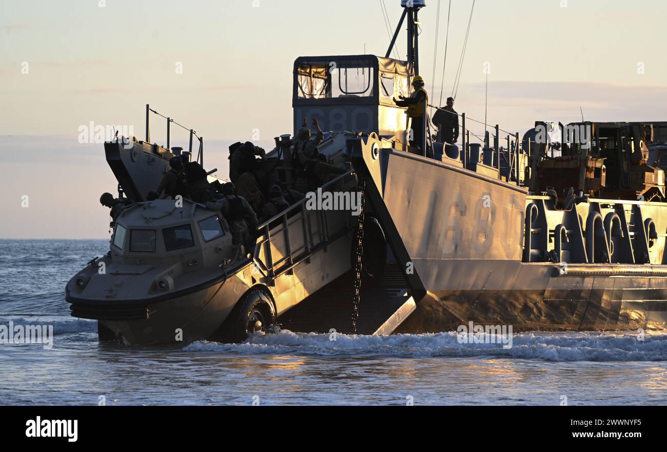 U.S. Navy Sailors, assigned to Beachmaster Unit 1, operate a Landing ...