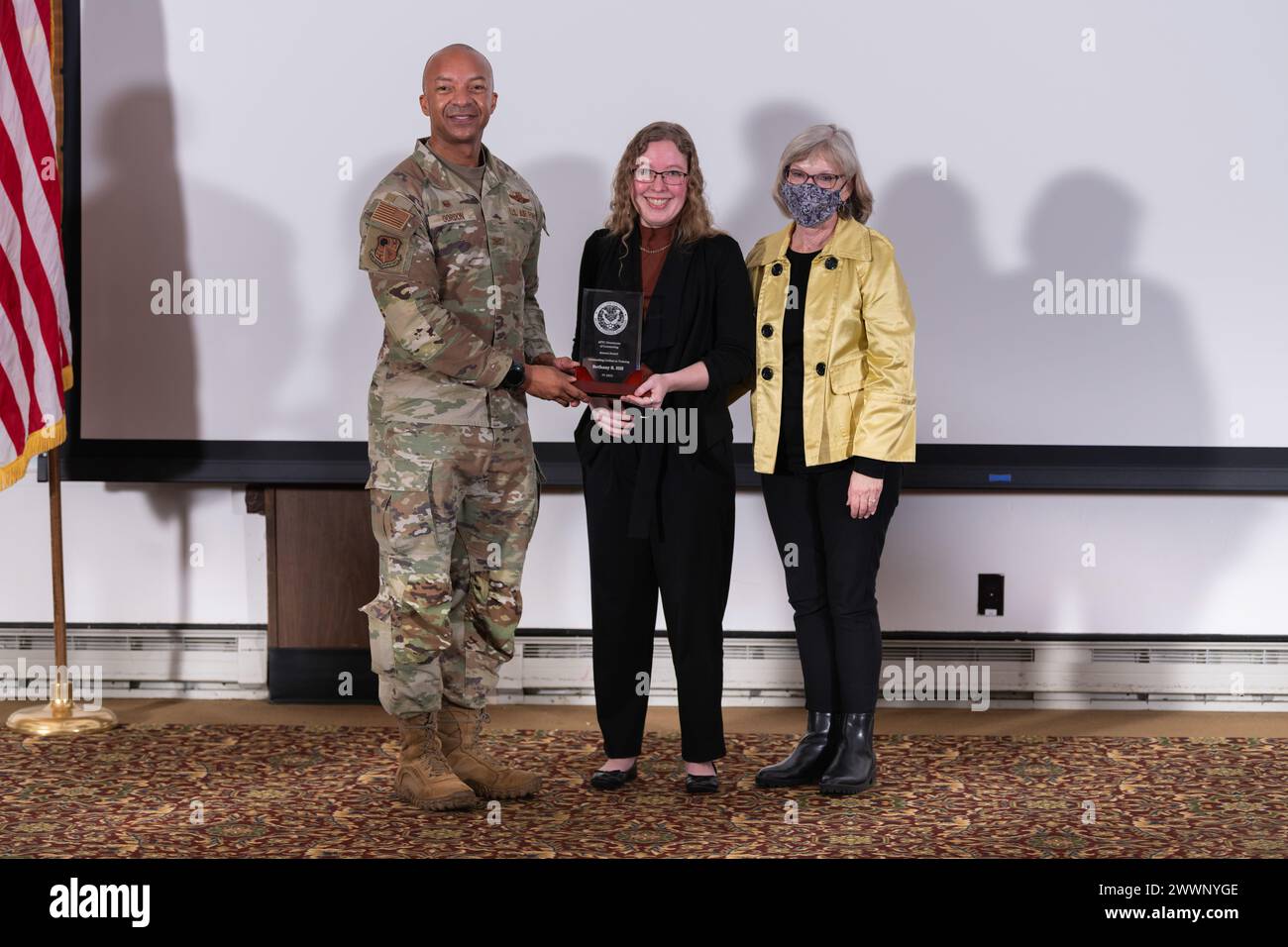 Bethany Hill with AFTC/PZ, center, accepts the award for Outstanding ...