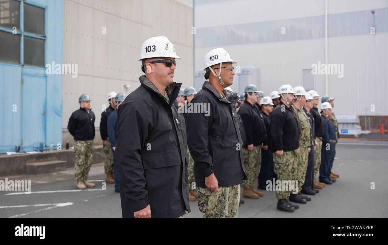 YOKOSUKA, Japan (Feb. 18, 2024) — Capt. Zaldy M. Valenzuela (right) and CMDCM Thomas D. Howell ...