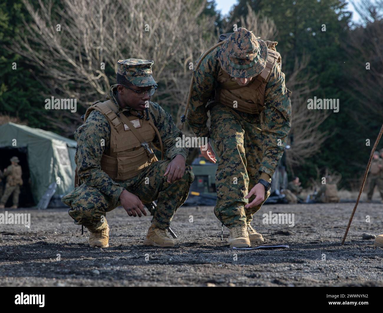 U.S. Marine Corps 1st Lt. Mason Cannistraro, right, a supply officer ...