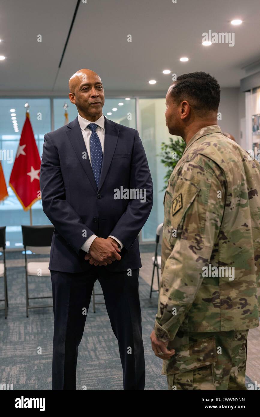 Antonio J. Amos (left) speaks with Maj. Gen. Daryl O. Hood (right), the commanding general of ...