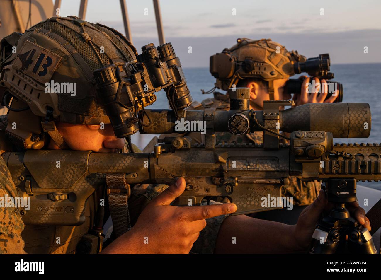 U.S. Marine Corps Sgt. Christian Genetti, left, and Sgt. Alec Hunter, right, both scout snipers ...