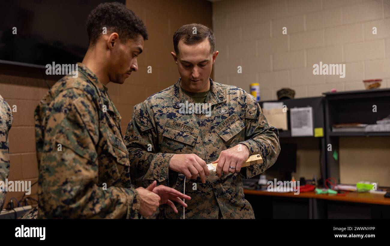 U.S. Marine Corps Sgt. Mitchel Swafford, right, an explosive ordnance ...
