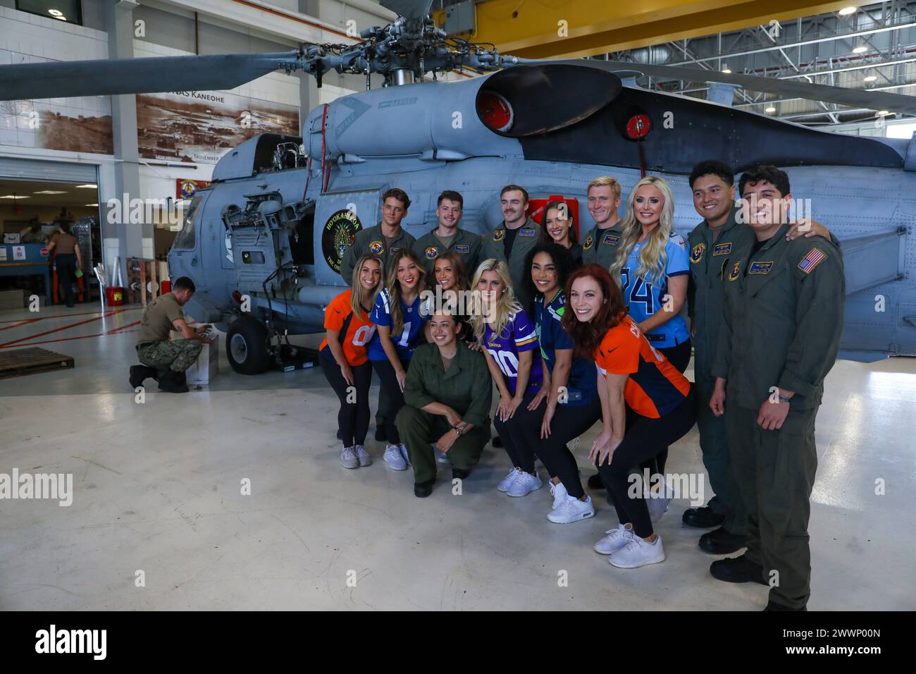 U.S. Marines and NFL cheerleaders pose for a picture during the Armed ...