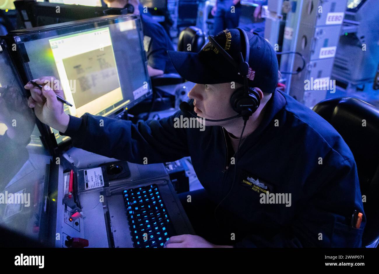 PHILIPPINE SEA (Feb. 1, 2024) Ensign Sonny Gunthorpe stands watch in ...