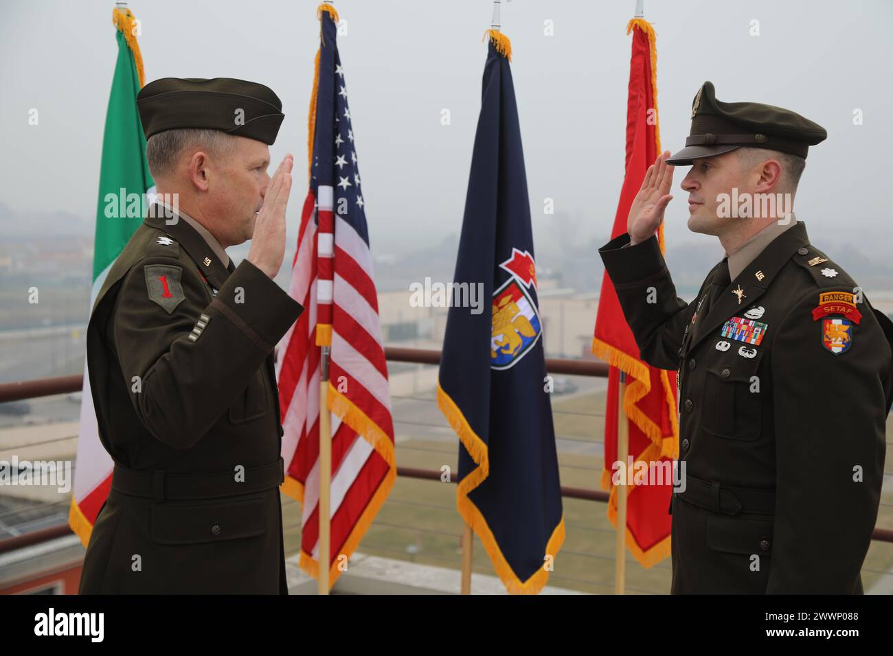 Lt. Col. Ryan Goulet, operations officer, SETAF-AF, right, renews his ...