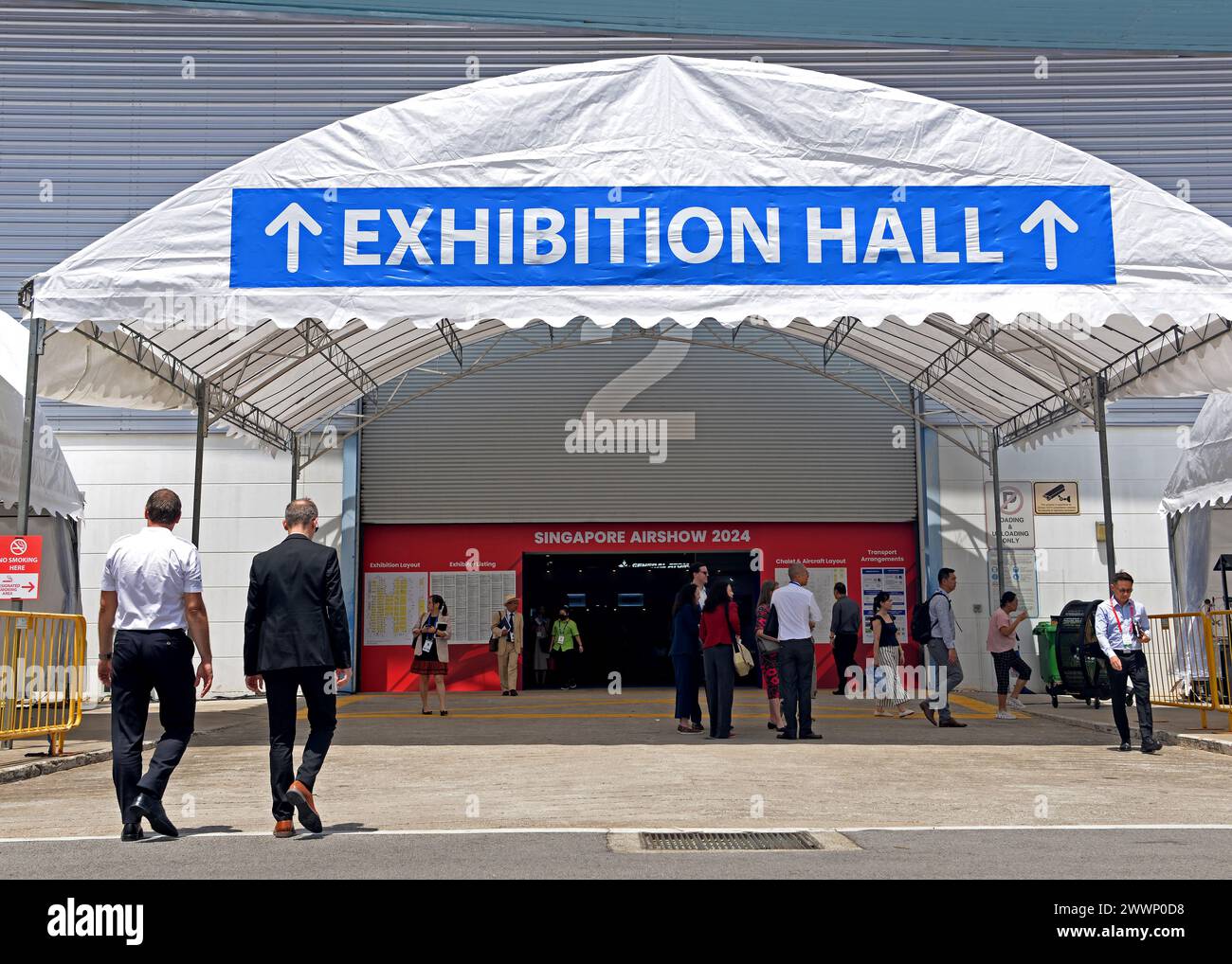 Crowds walk through Exhibition Hall during the Singapore Airshow 2024 ...