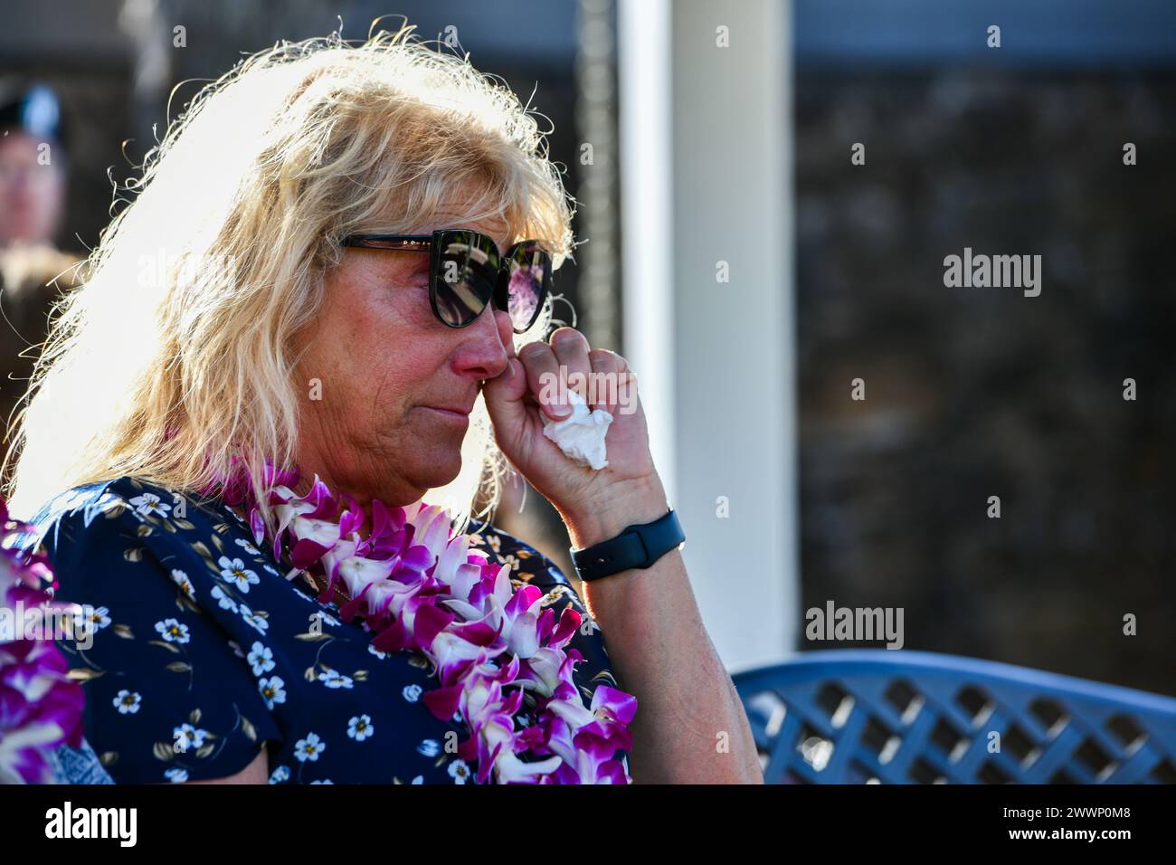 A family member of U.S. Army Cpl. Adin C. Norris Jr., sheds a tear ...