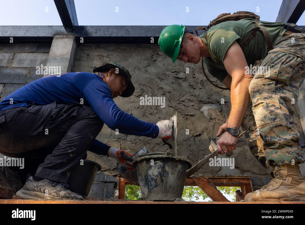 U.S. Marine Corps Cpl. Connor Huften, right, a combat engineer with ...