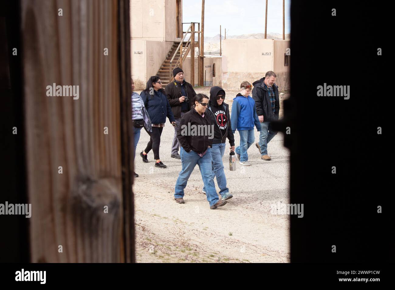 Guests of a Community Box Tour stroll through a village in the training ...