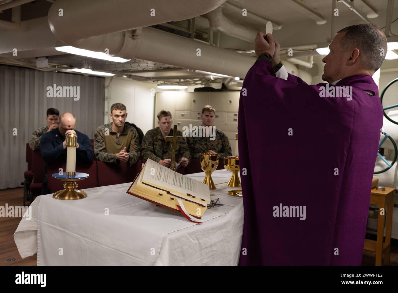 U.S. Navy Cmdr. Daniel Fullerton, right, the chaplain of the amphibious ...