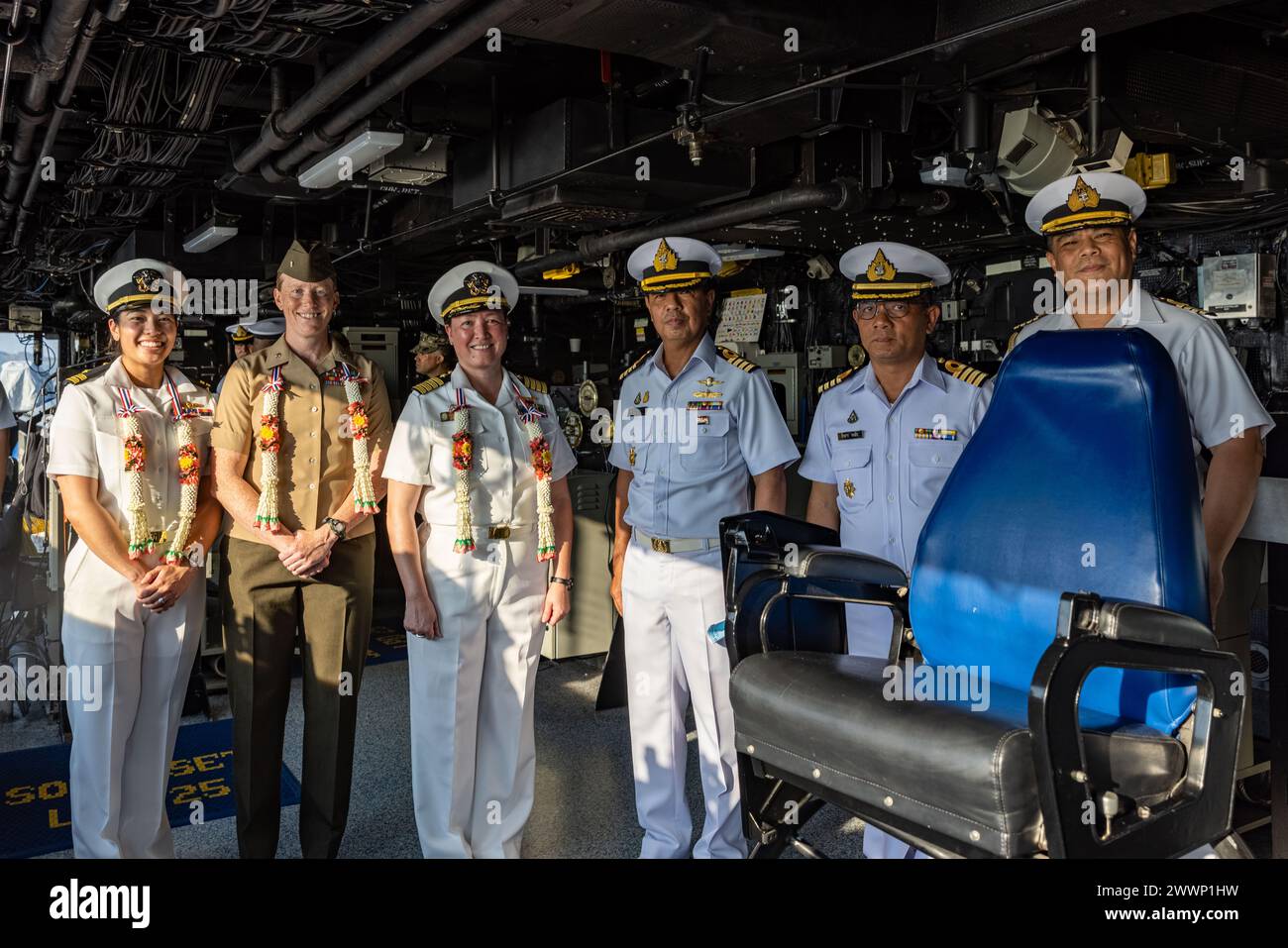 U.S. Navy Capt. Michel Brandt, center left, commanding officer of the ...