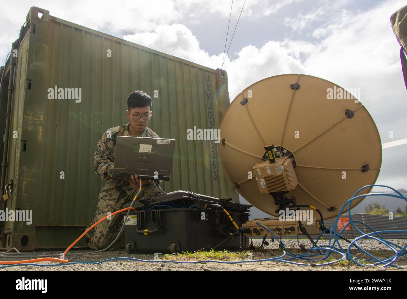 U.S. Marine Corps Sgt. Stetson Jansen, left, data systems administrator ...