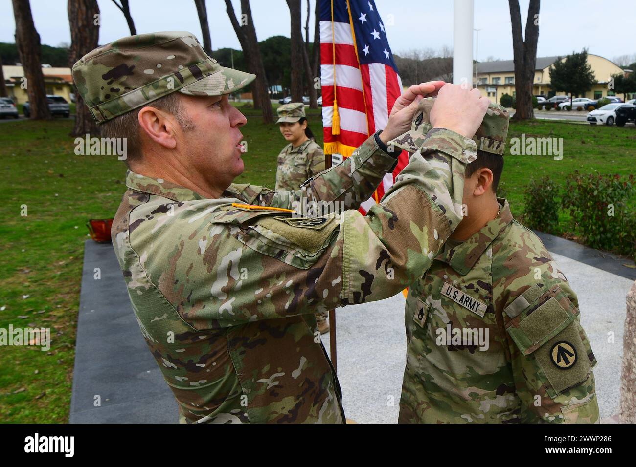 Left, U.S. Army Lt. Col. Michael S. Harrell commander of 839th Transportation Battalion applies ...