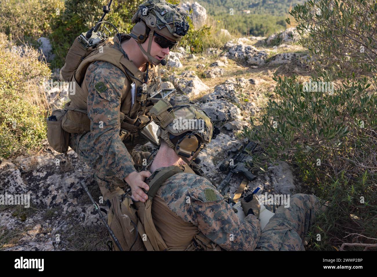 U.S. Marine Corps 1st Lt. Karl Skerry, left, a fire support officer ...