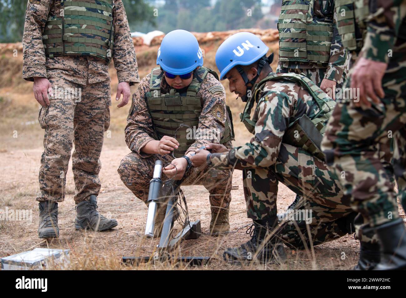 Mongolian Army and Nepali Army Explosive Ordnance Disposal (EOD) technicians, students in the ...
