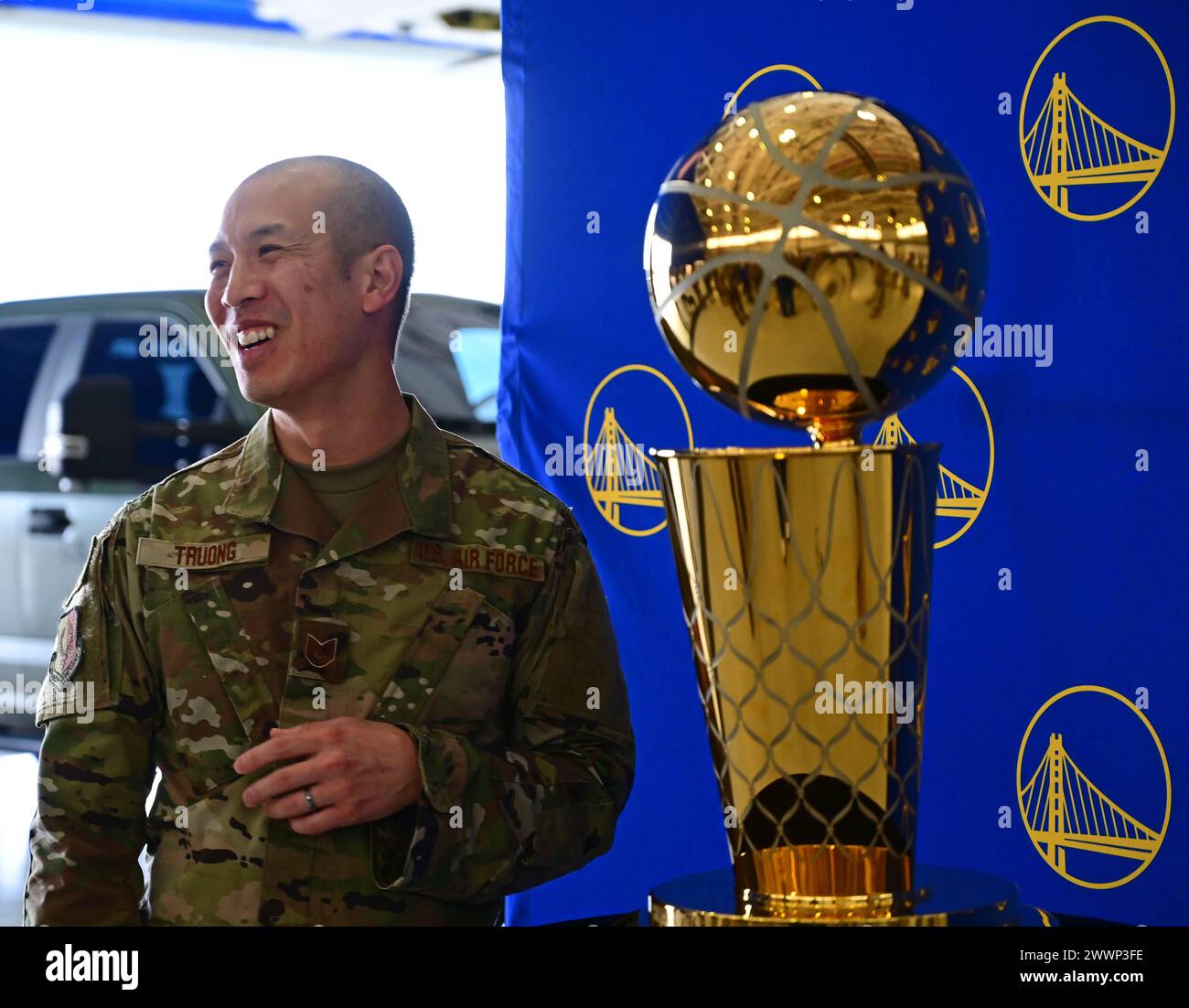 U.S. Air Force Tech. Sgt. Huang Truong takes a photo with the NBA’s ...