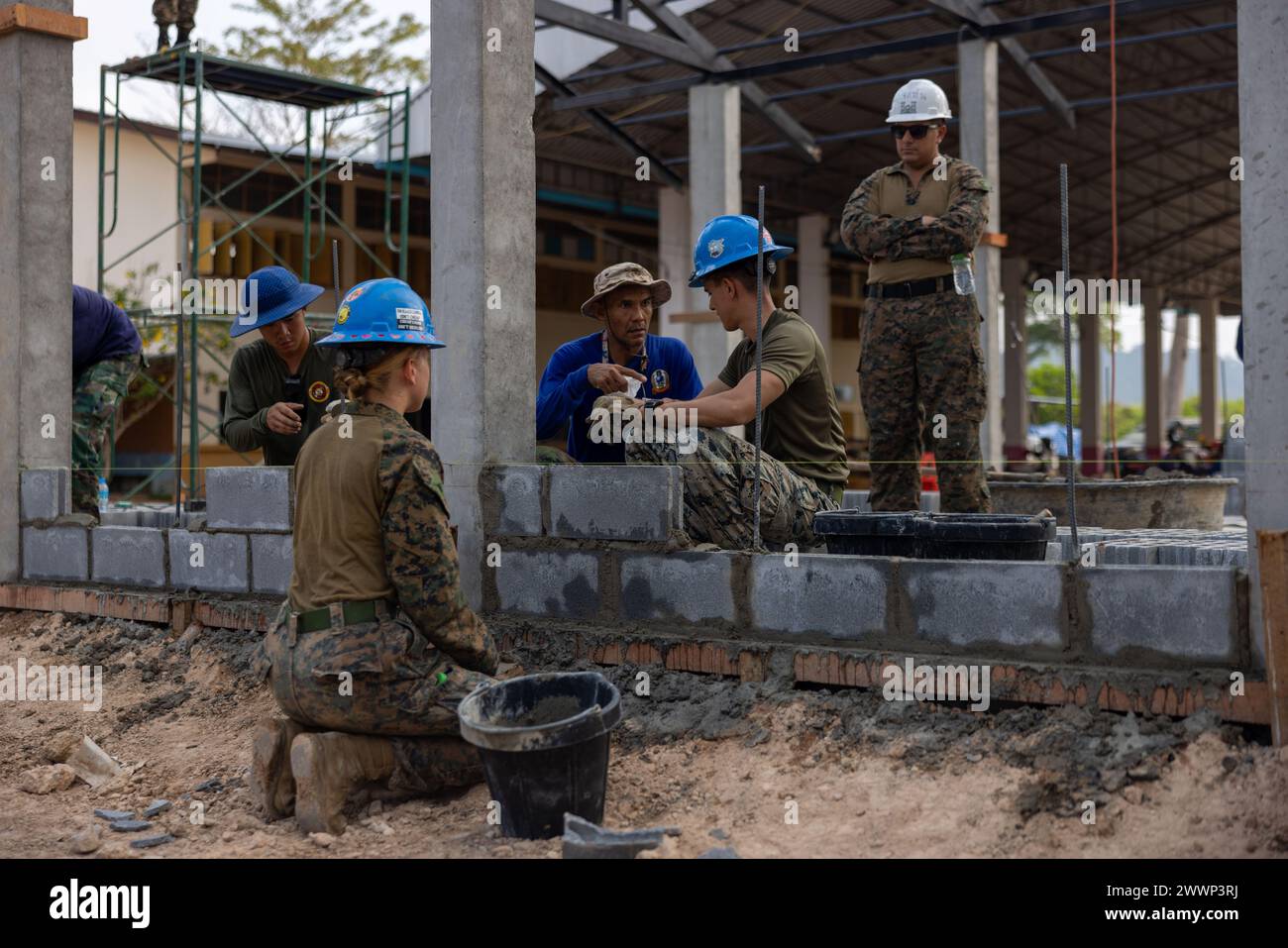 U.S. Marine Corps Cpl. Kelsey Alves, left, a heavy equipment operator ...